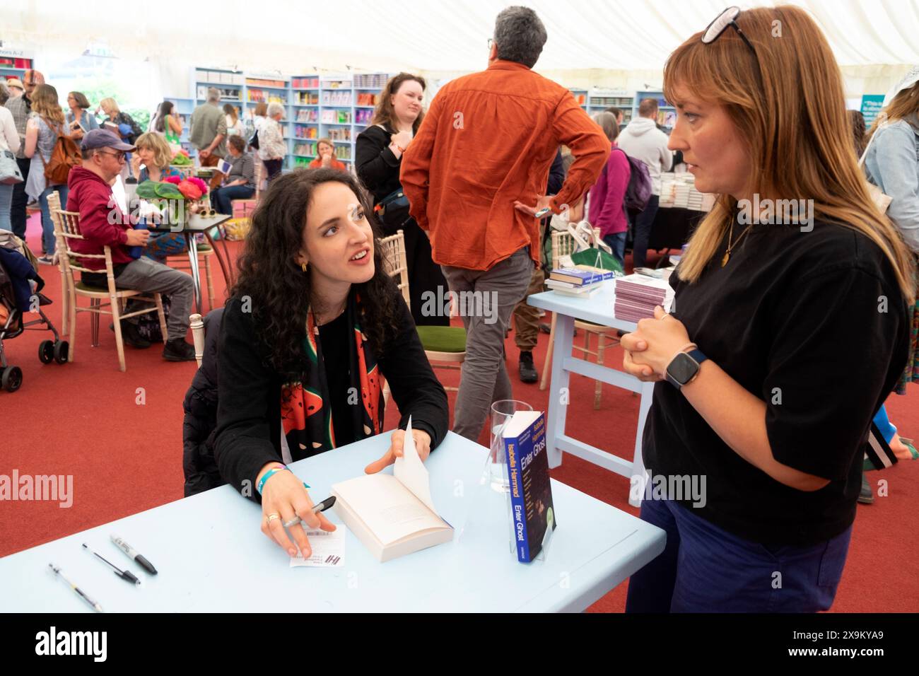 Young woman talking to British Palestinian author Isabella Hammad of ...