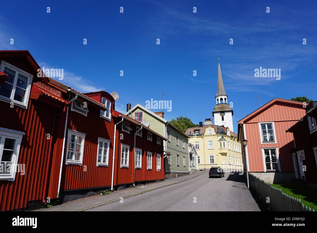 a city street between buildings Stock Photo - Alamy