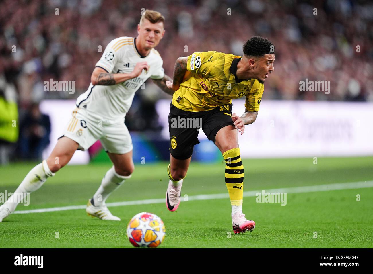 Borussia Dortmund's Jadon Sancho (right) and Real Madrid's Toni Kroos ...