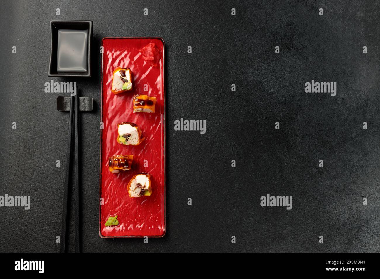 a Mami roll with succulent snow crab is elegantly showcased against a ...