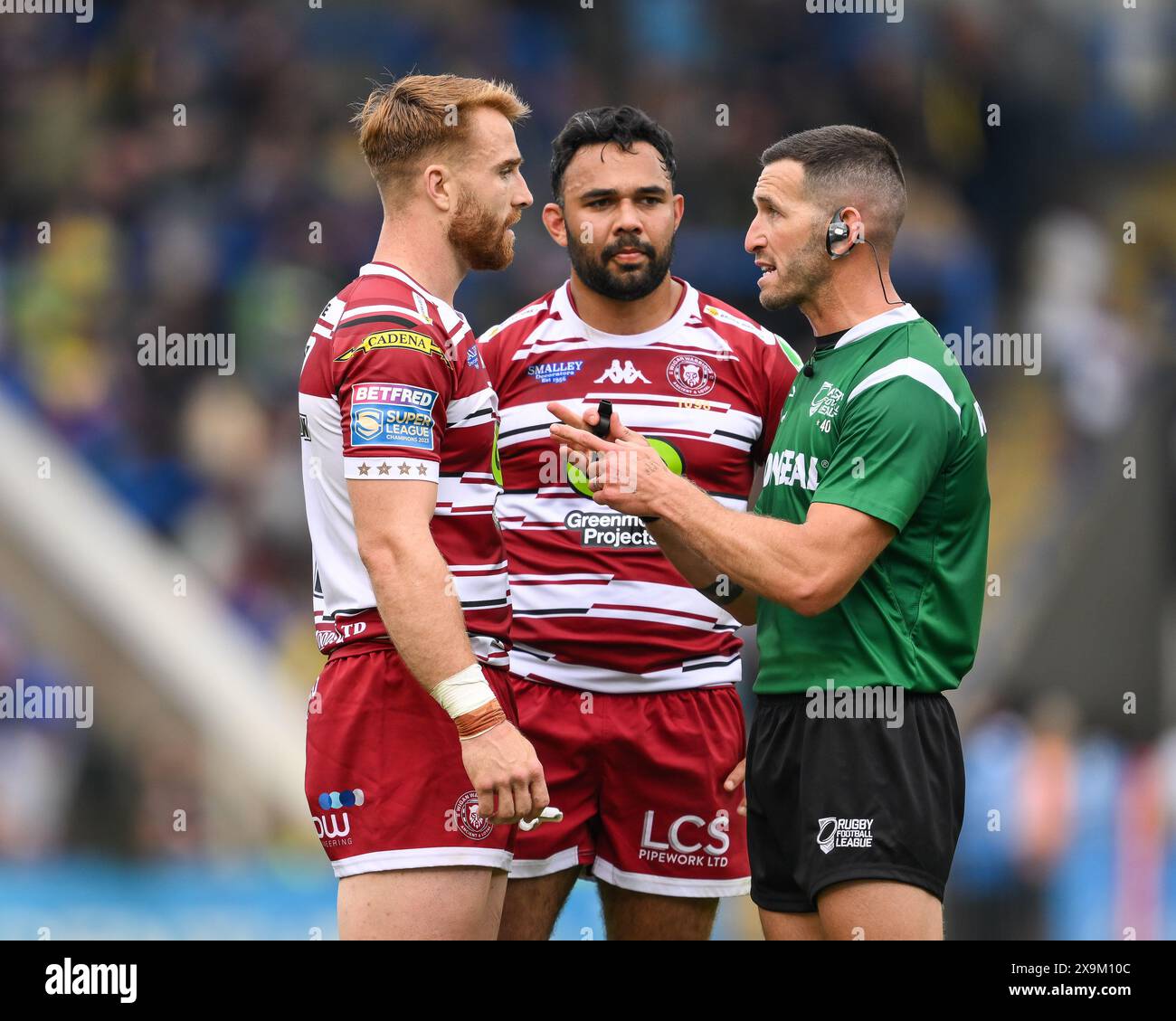 referee Jack Smith gives a red card to Adam Keighran of Wigan Warriors ...