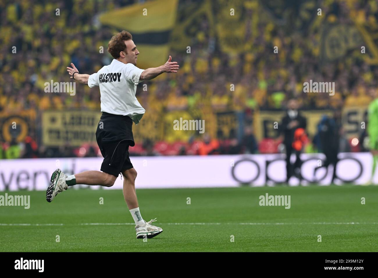 a streaker pictured on the pitch with a shirt with Mellstroy on it ...