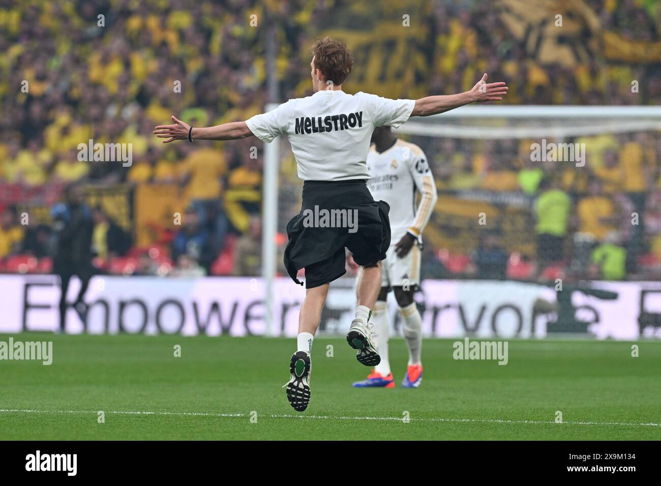 a streaker pictured on the pitch with a shirt with Mellstroy on it ...