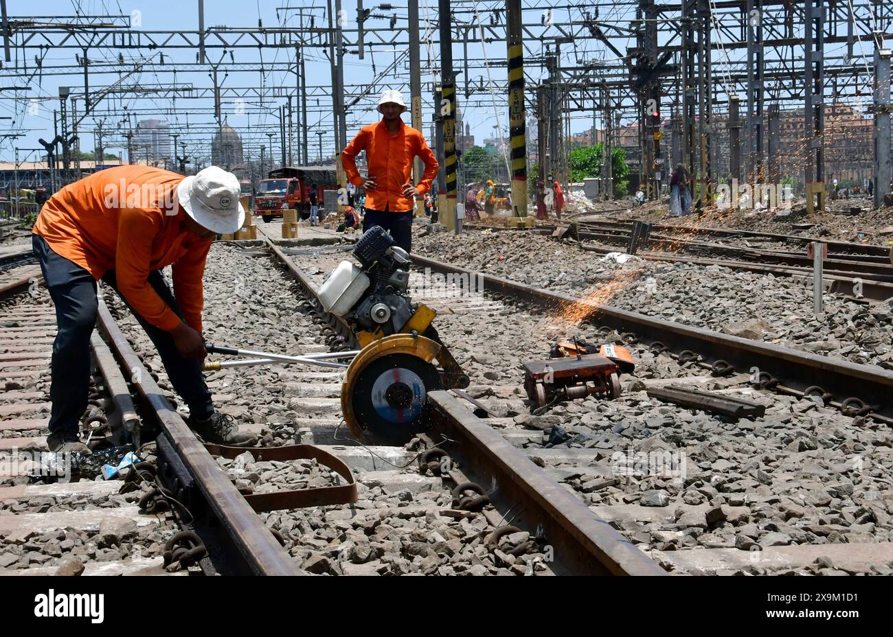 MUMBAI, INDIA - JUNE 1: Laborers work for the extension of platforms 10 ...