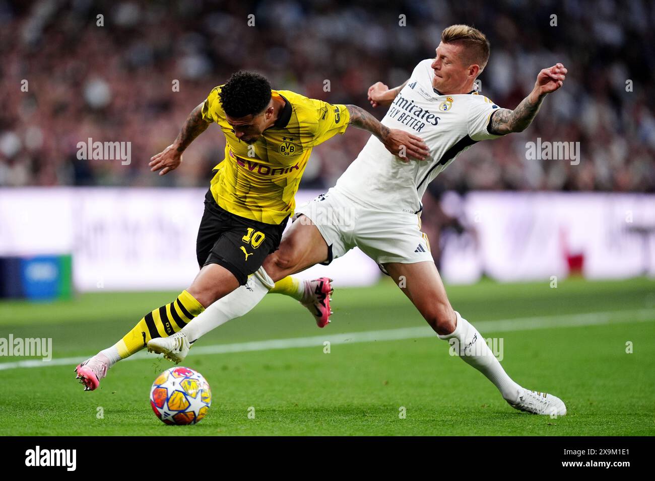 Borussia Dortmund's Jadon Sancho (left) and Real Madrid's Toni Kroos ...