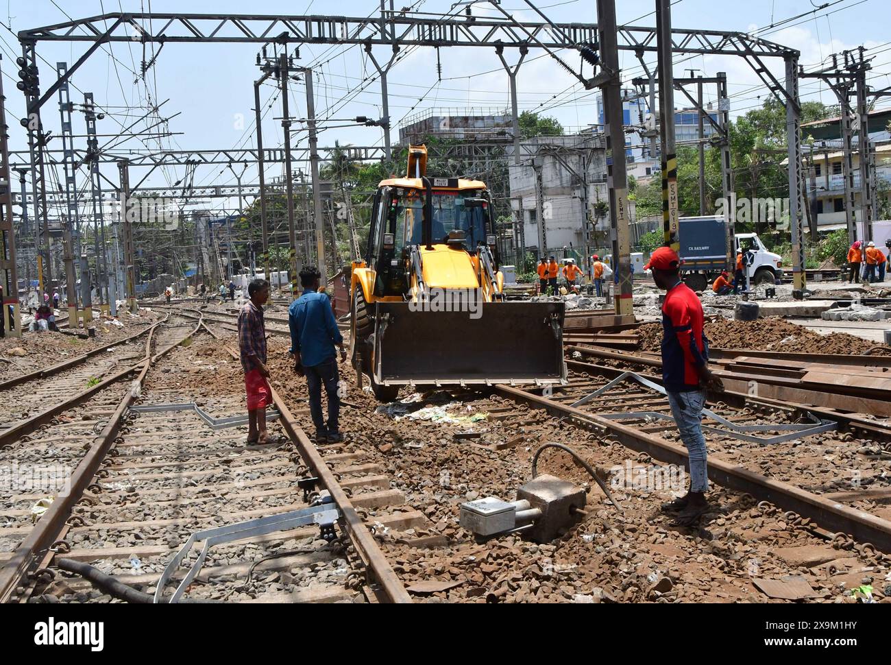 MUMBAI, INDIA - JUNE 1: Laborers work for the extension of platforms 10 and 11 to accommodate 24 ...
