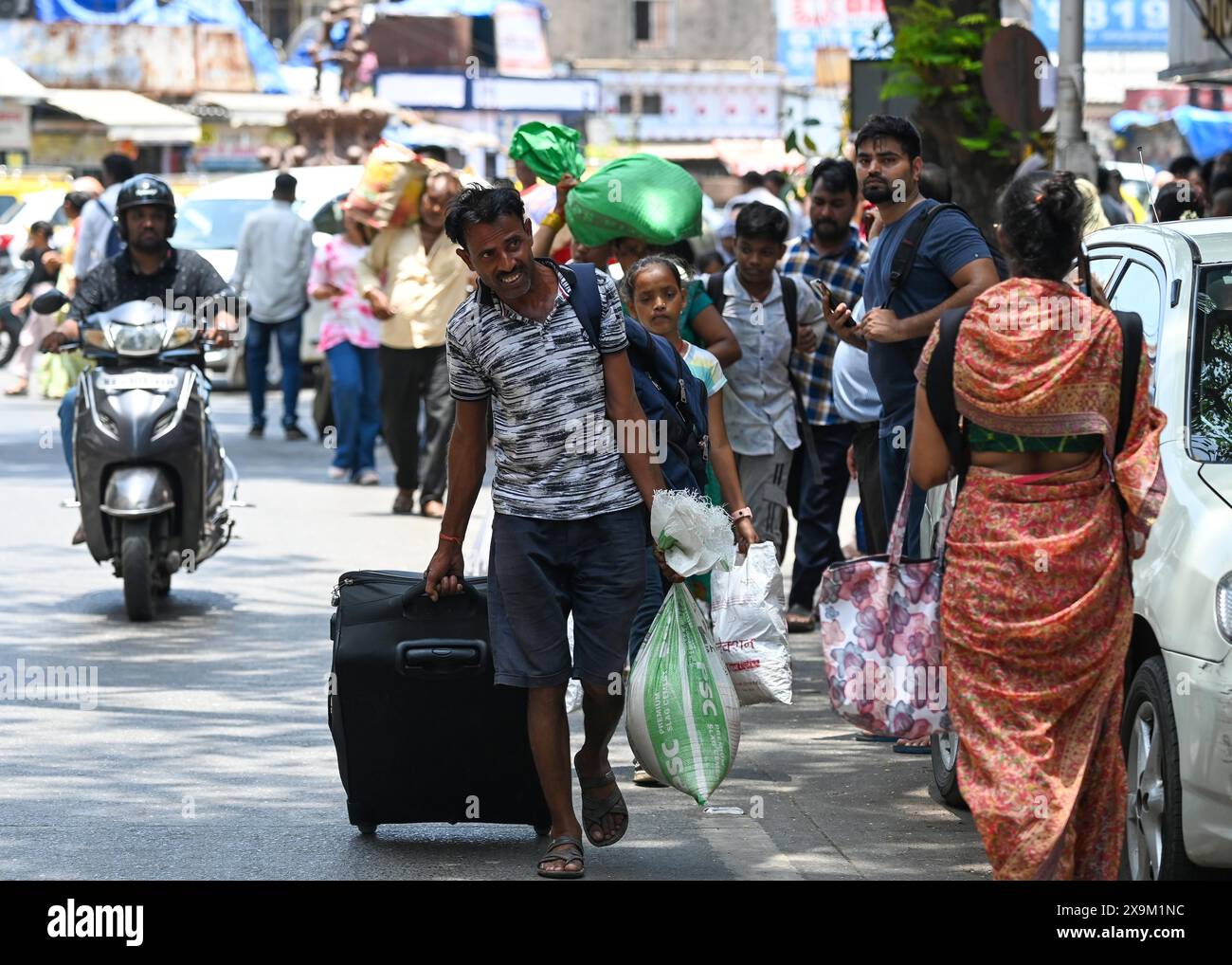 MUMBAI, INDIA - JUNE 1: Passengers are awaiting a taxi outside Dadar ...