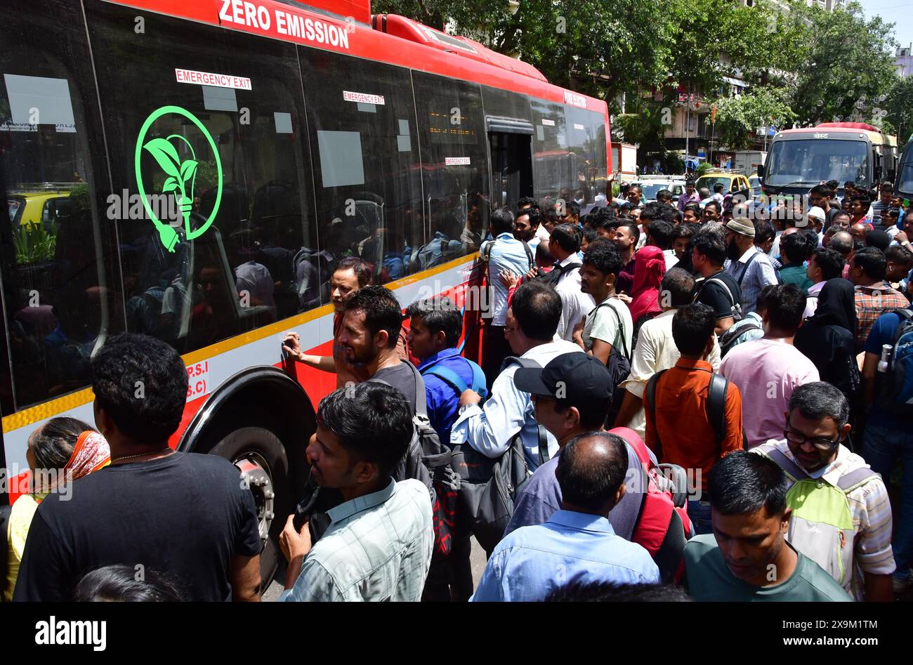 MUMBAI, INDIA - JUNE 1: Railway commuters rush to catch the Best Bus to reach CST, at Byculla ...