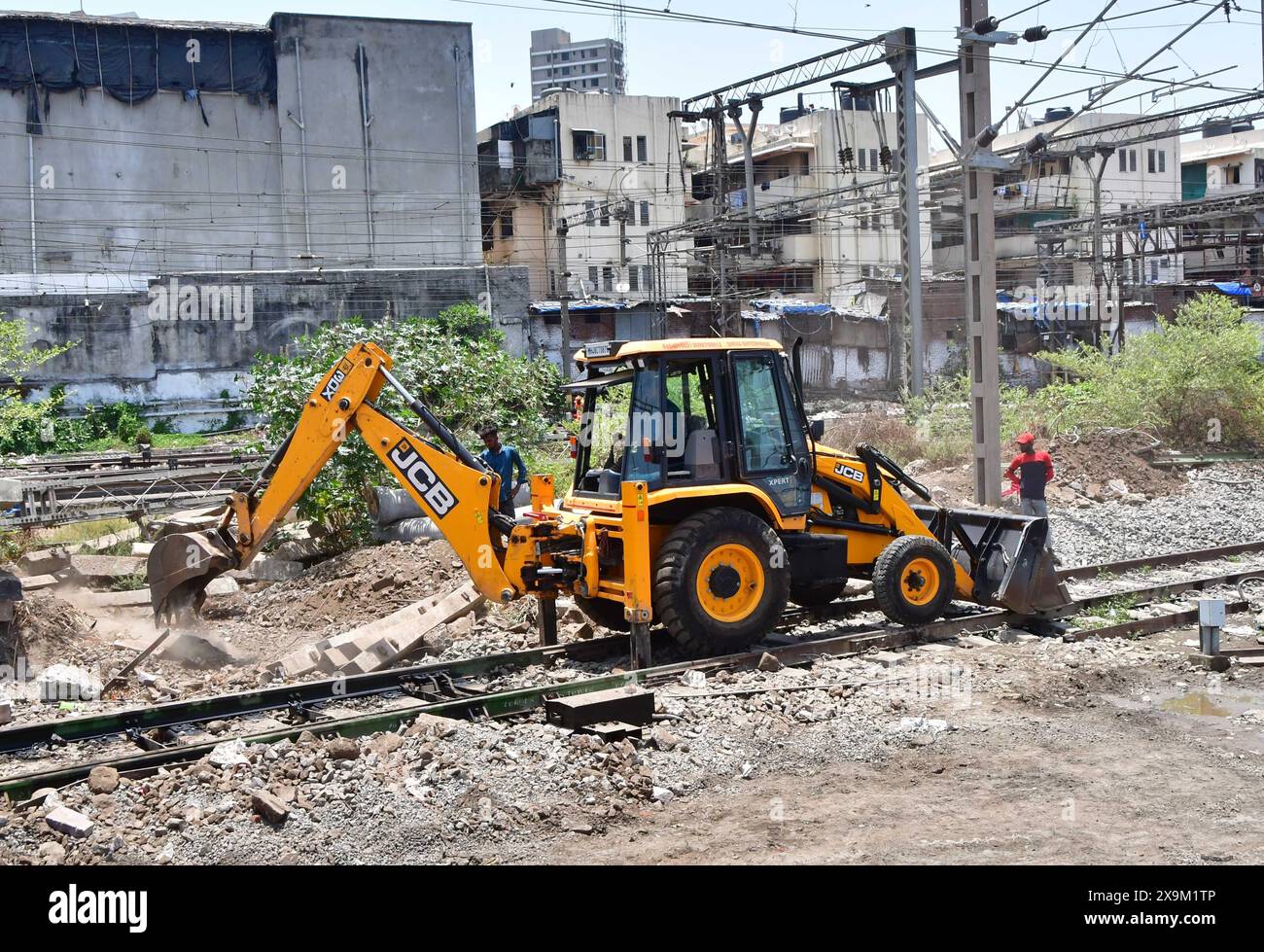 MUMBAI, INDIA - JUNE 1: Laborers work for the extension of platforms 10 ...