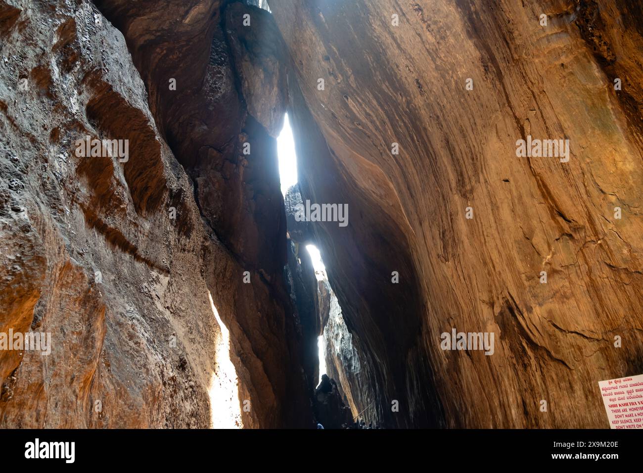 Discover the tranquil beauty of an ancient cave bathed in sunlight ...