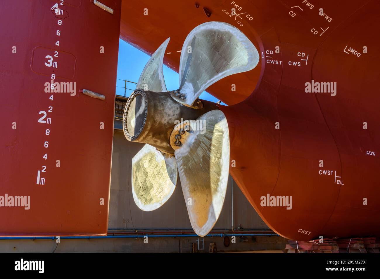 Cargo vessel in dry dock on ship repairing yard. Variable pitch ...