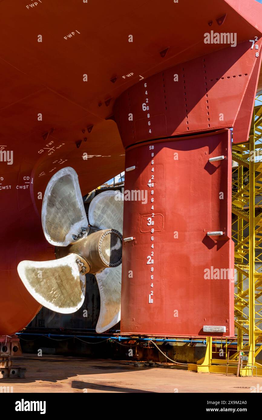 Cargo vessel in dry dock on ship repairing yard. Variable pitch ...