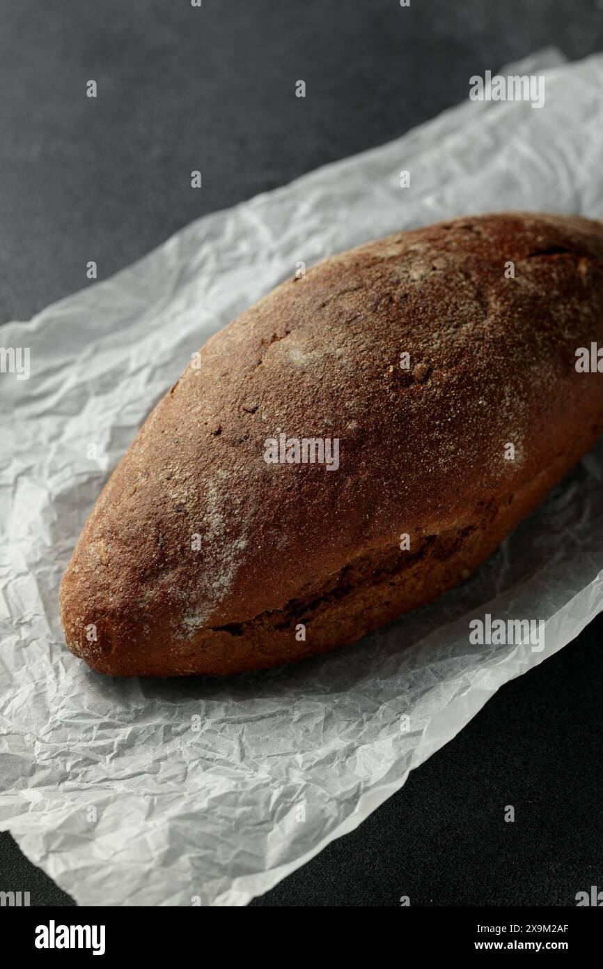 This captivating image features a rustic loaf of homemade raisin bread ...