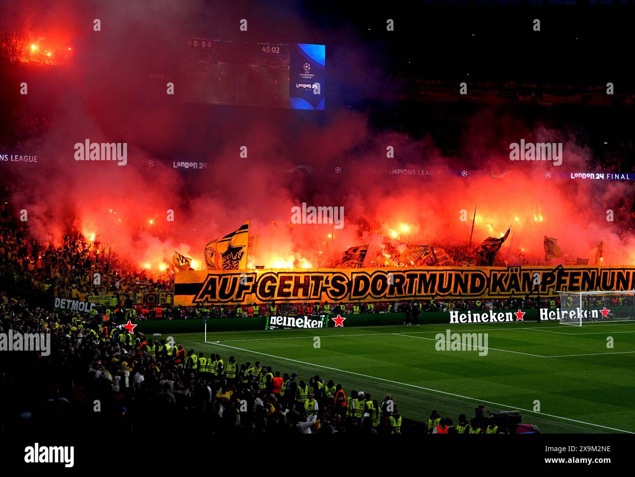 Borussia Dortmund fans let off smoke flares in the stands during the ...