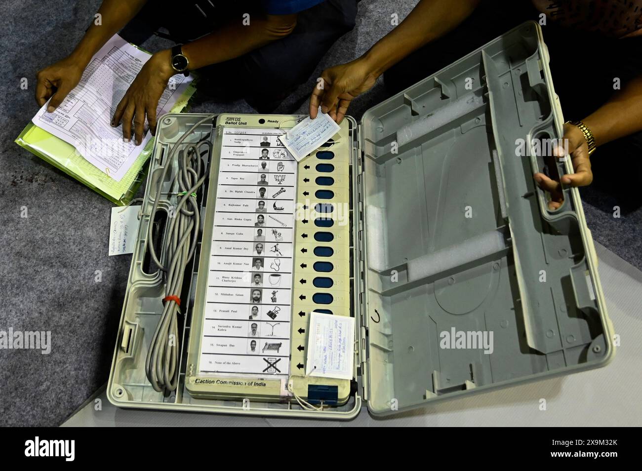 KOLKATA, INDIA - MAY 31: Polling officials check Electronic Voting ...