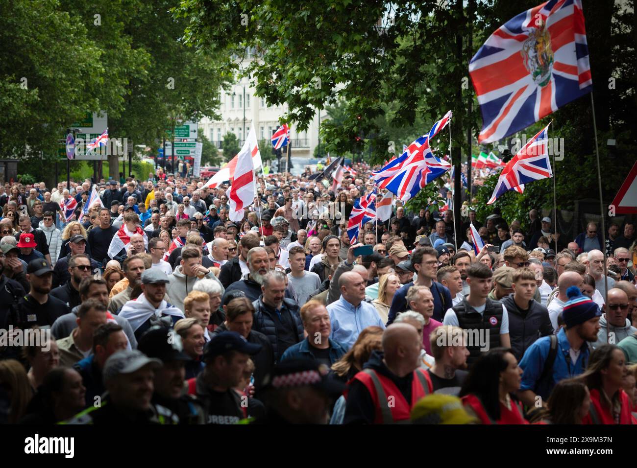 London, UK. 01st June, 2024. Thousands of people march with Ex-EDL ...