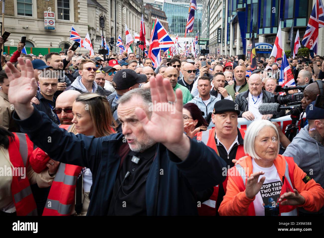 London, UK. 01st June, 2024. Thousands of people march with Ex-EDL ...