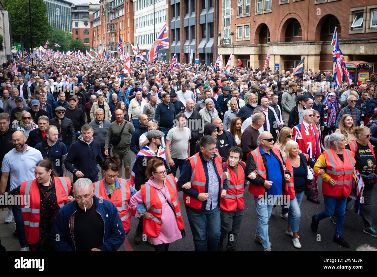 London, UK. 01st June, 2024. Thousands of people march with Ex-EDL ...