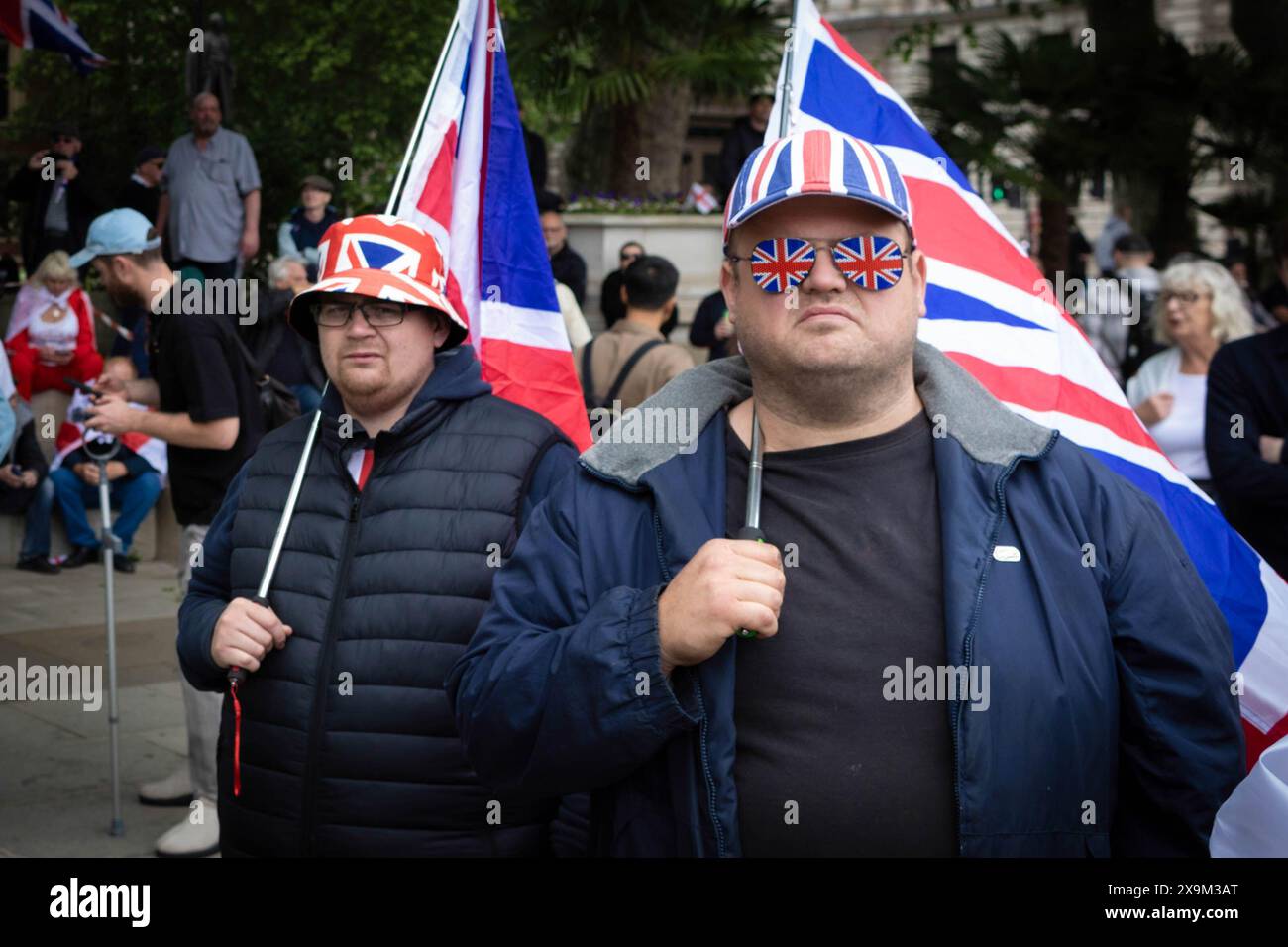 London, UK. 01st June, 2024. Two people with Union Jacks flags take ...
