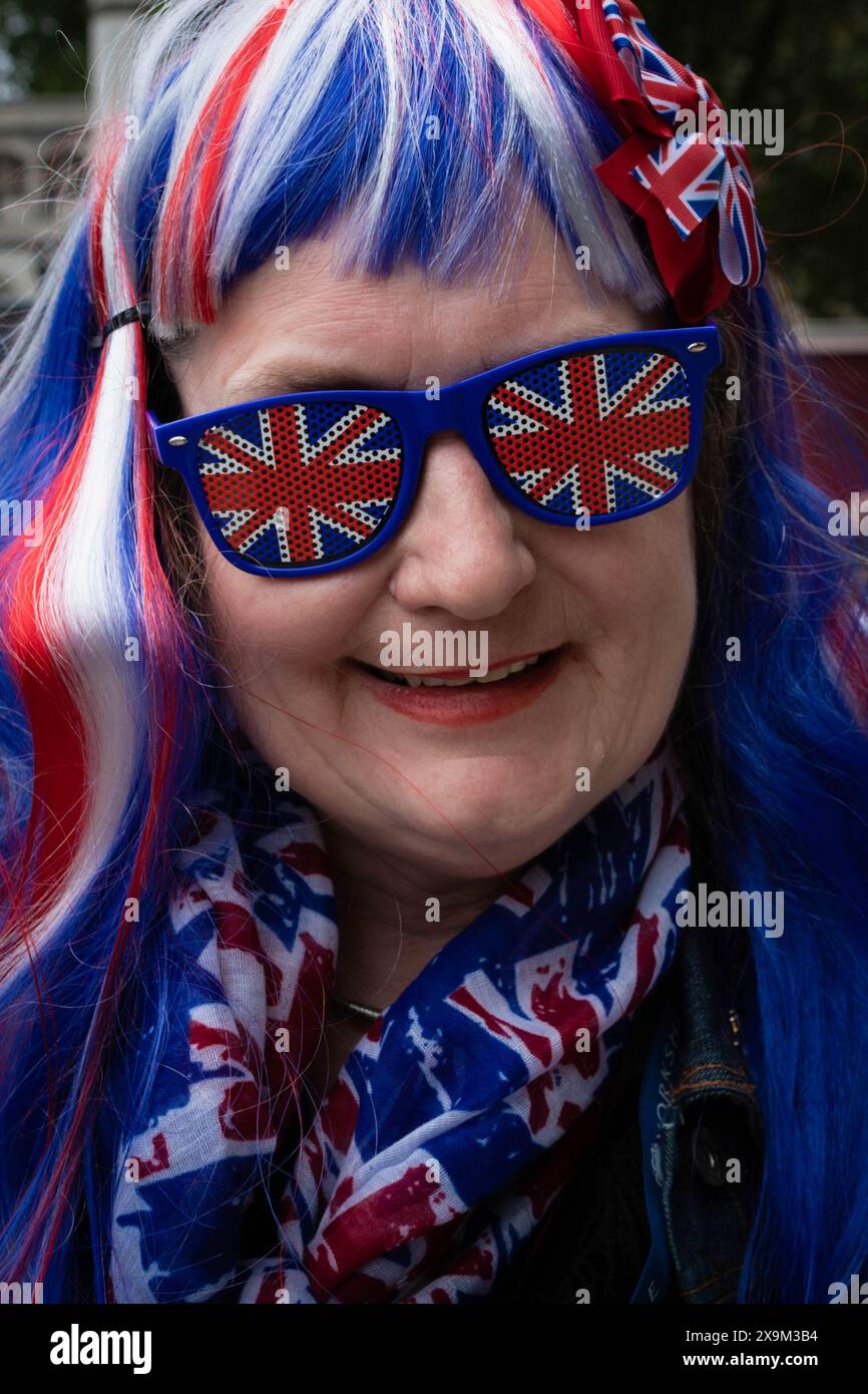 London, UK. 01st June, 2024. A woman with Union Jack sunglasses seen ...