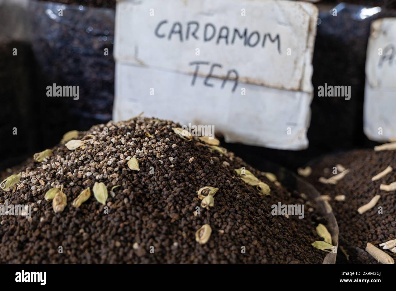 Close-up view of freshly harvested cardamom pods intermixed with rich ...