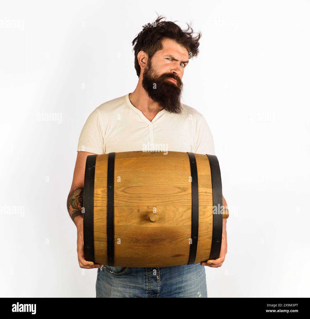 Homemade wine. Bearded man with wooden barrel of wine. Fermentation ...