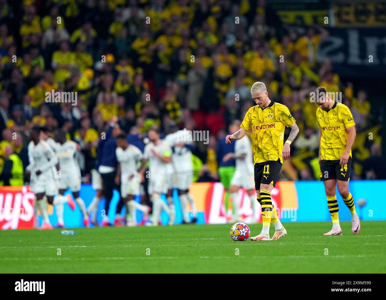 Borussia Dortmund's Marco Reus and Niclas Fullkrug appear dejected ...