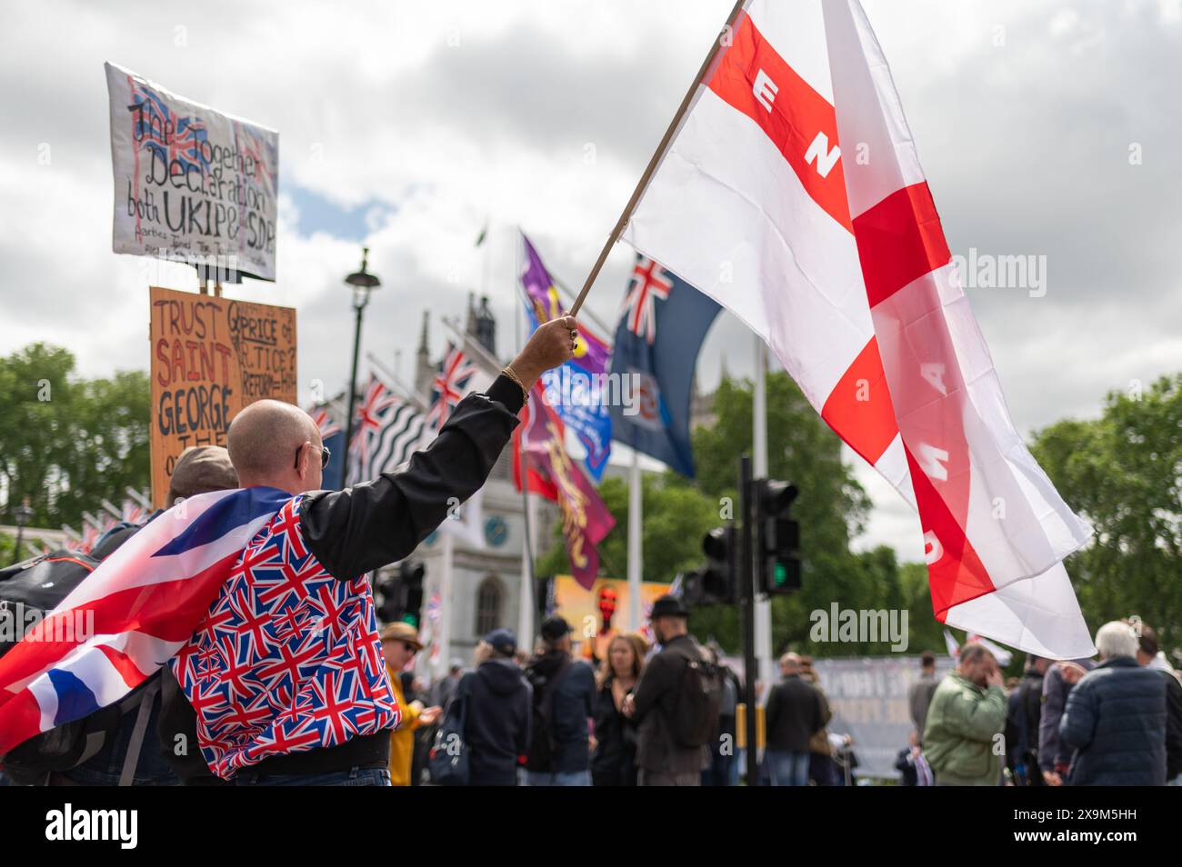 Tommy Robinson supporter seen waving English flag during the rally ...