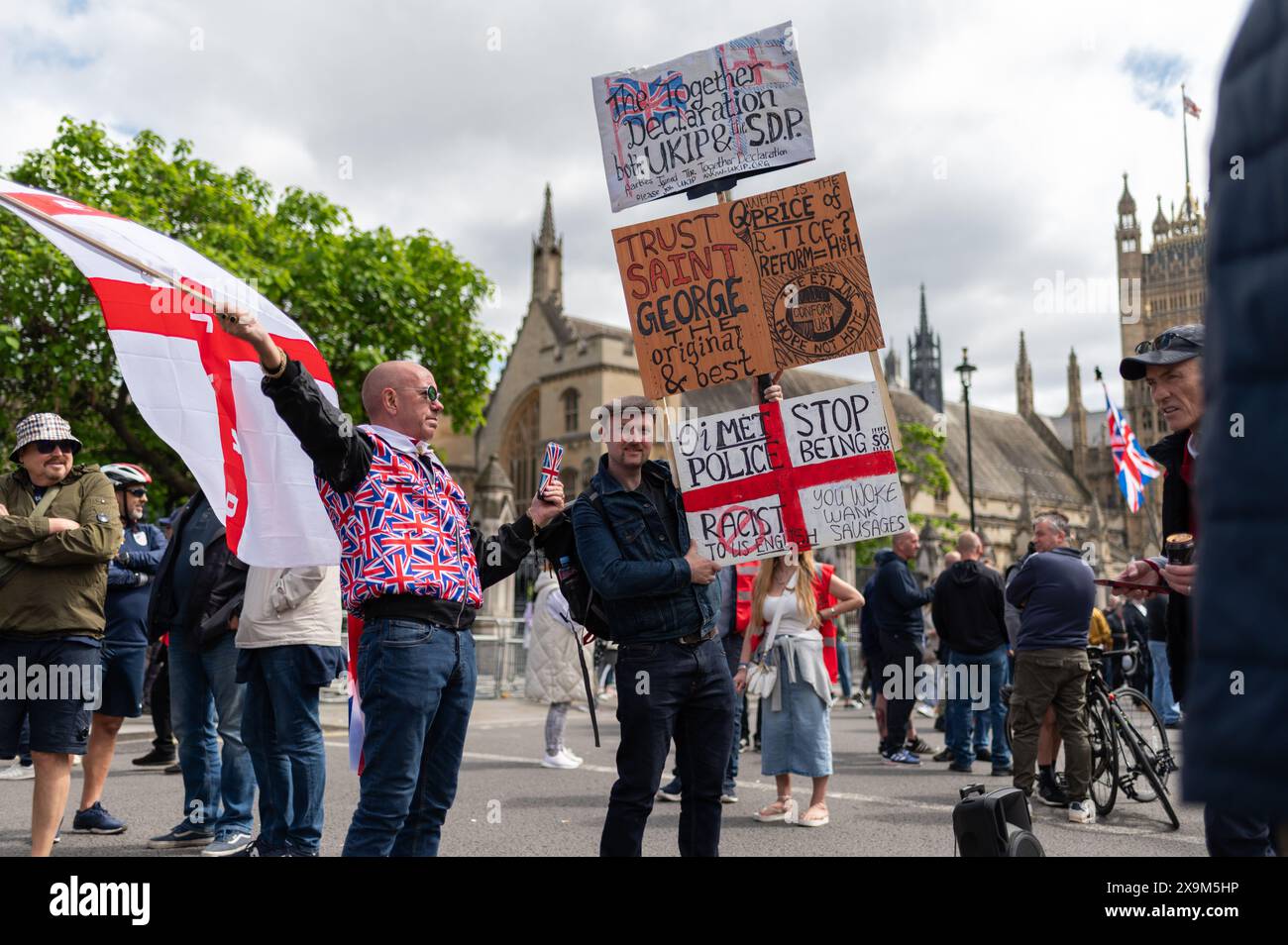 London, UK. 01st June, 2024. Tommy Robinson supporters hold English ...