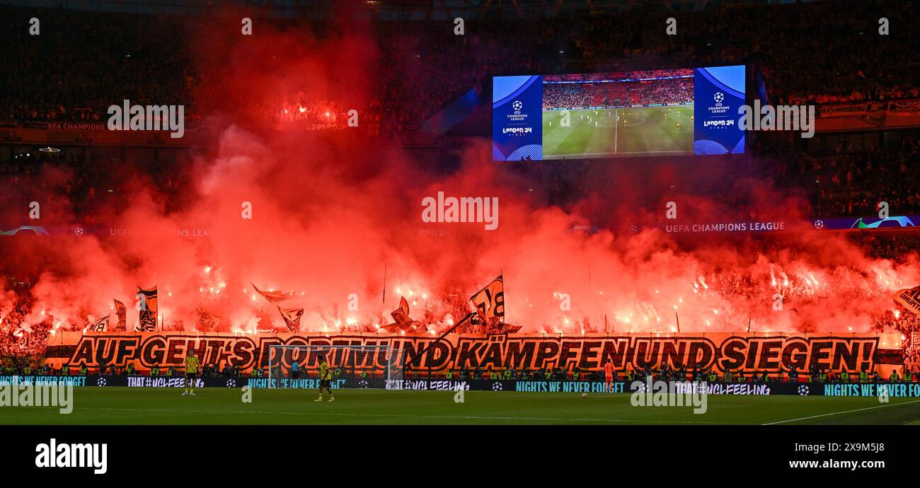 fans and supporters of Dortmund using pyrotechnical flares and ...