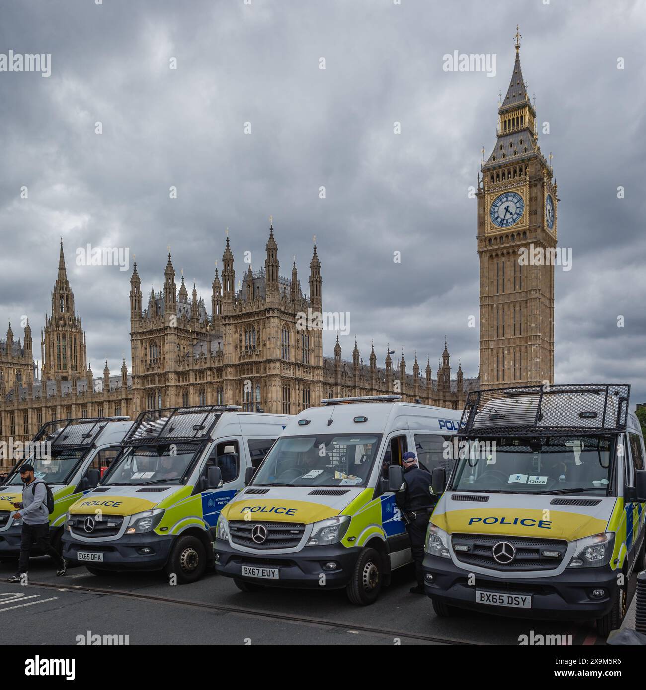 Police vehicles block Westminster bridge during a protest in London's ...