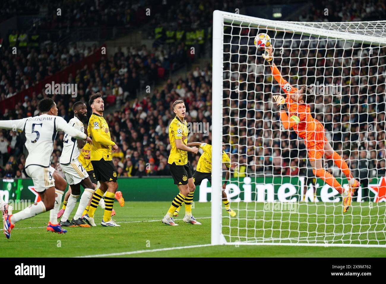 Borussia Dortmund goalkeeper Gregor Kobel (right) makes a save during ...