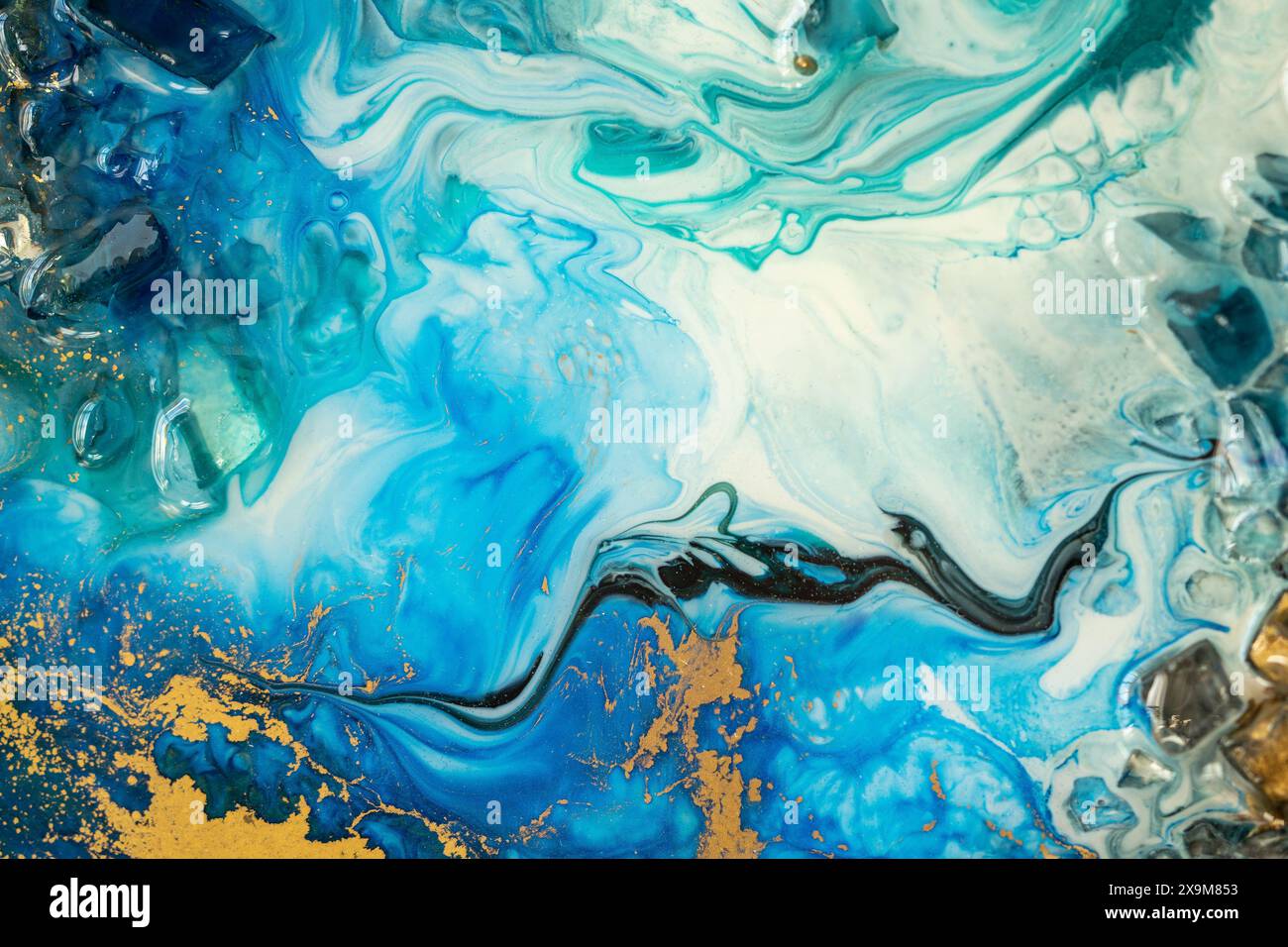 Closeup of resin art painting with blue sea waves mixing colors ...