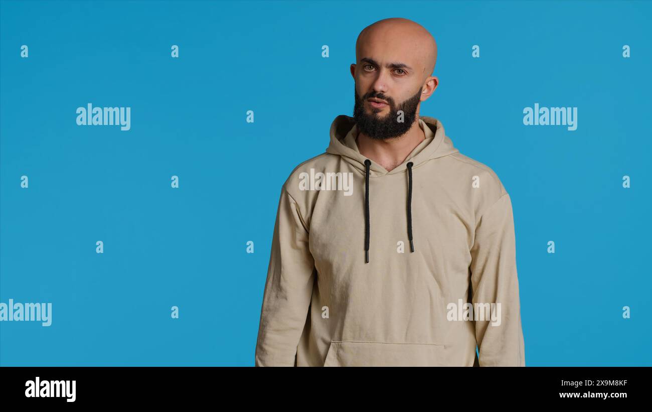 Young guy gesturing no sign over studio background, posing in studio ...