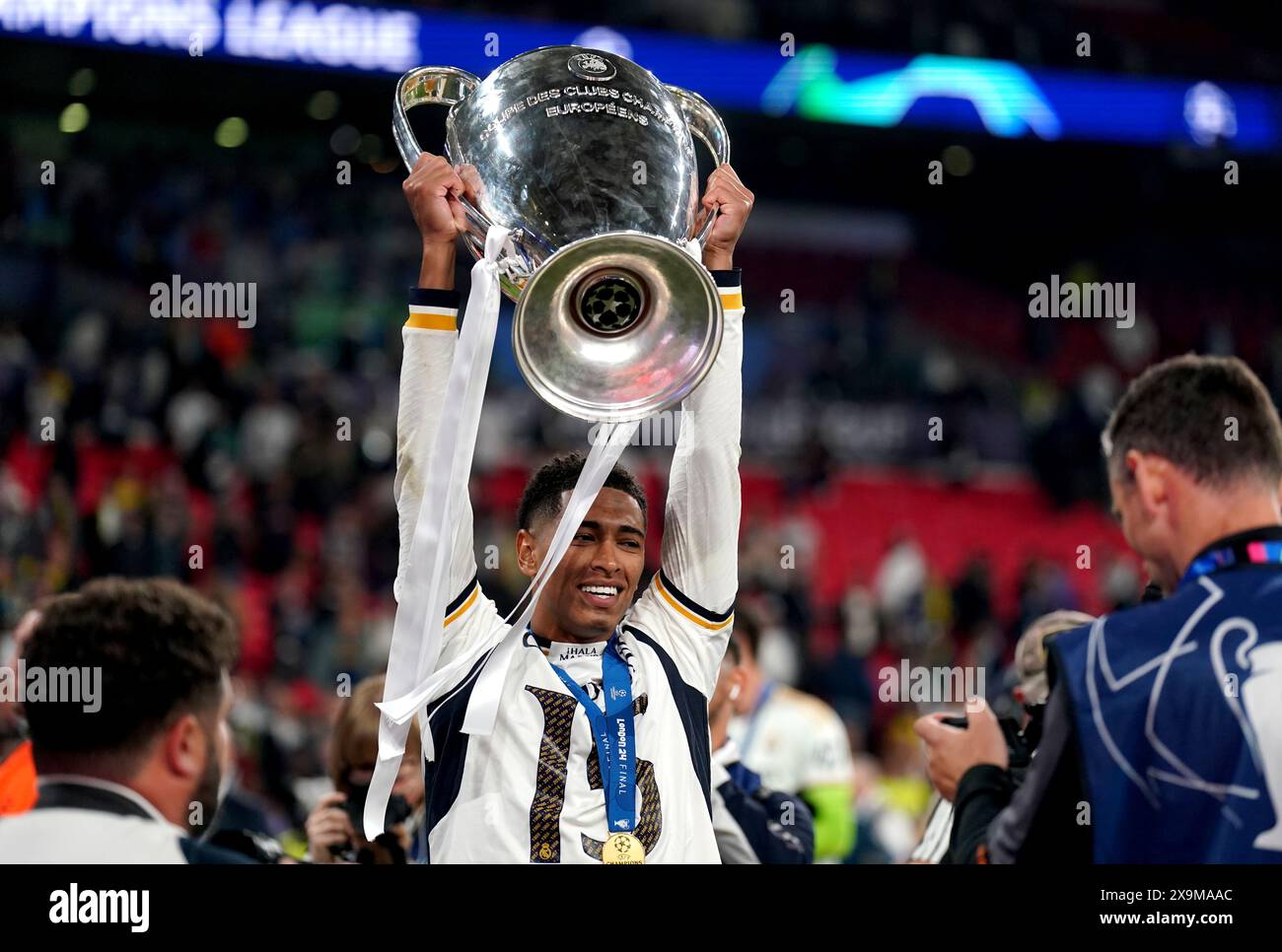 Real Madrid's Jude Bellingham celebrates with the trophy after winning ...