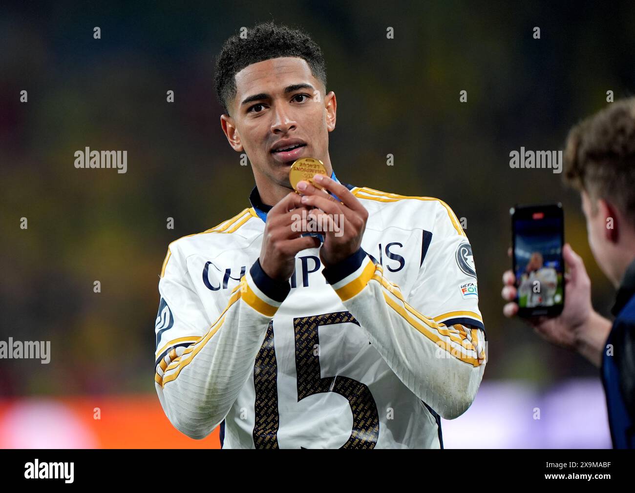 Real Madrid's Jude Bellingham celebrates his medal after winning the ...