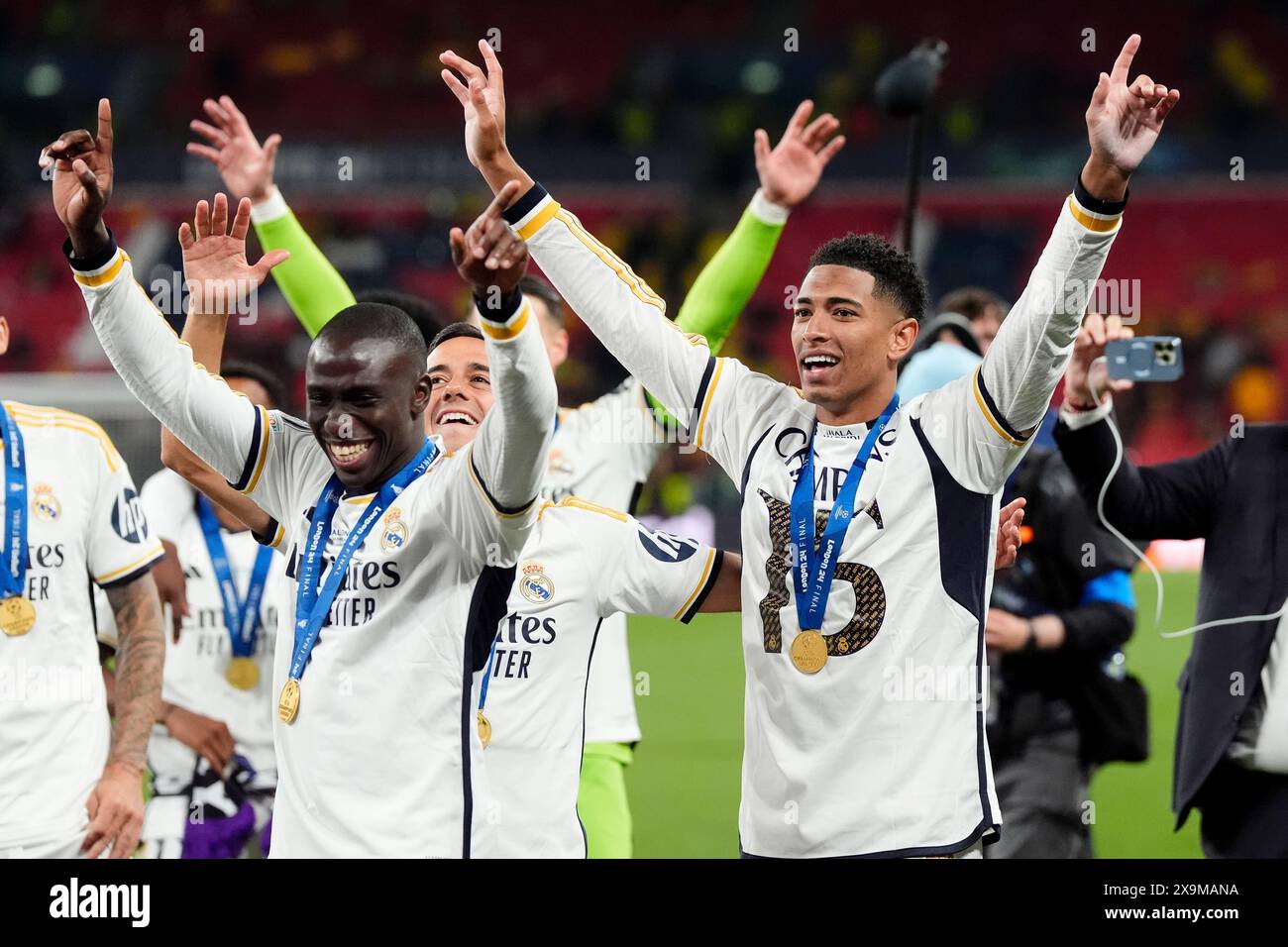 Real Madrid's Jude Bellingham (right) celebrates after winning the UEFA ...