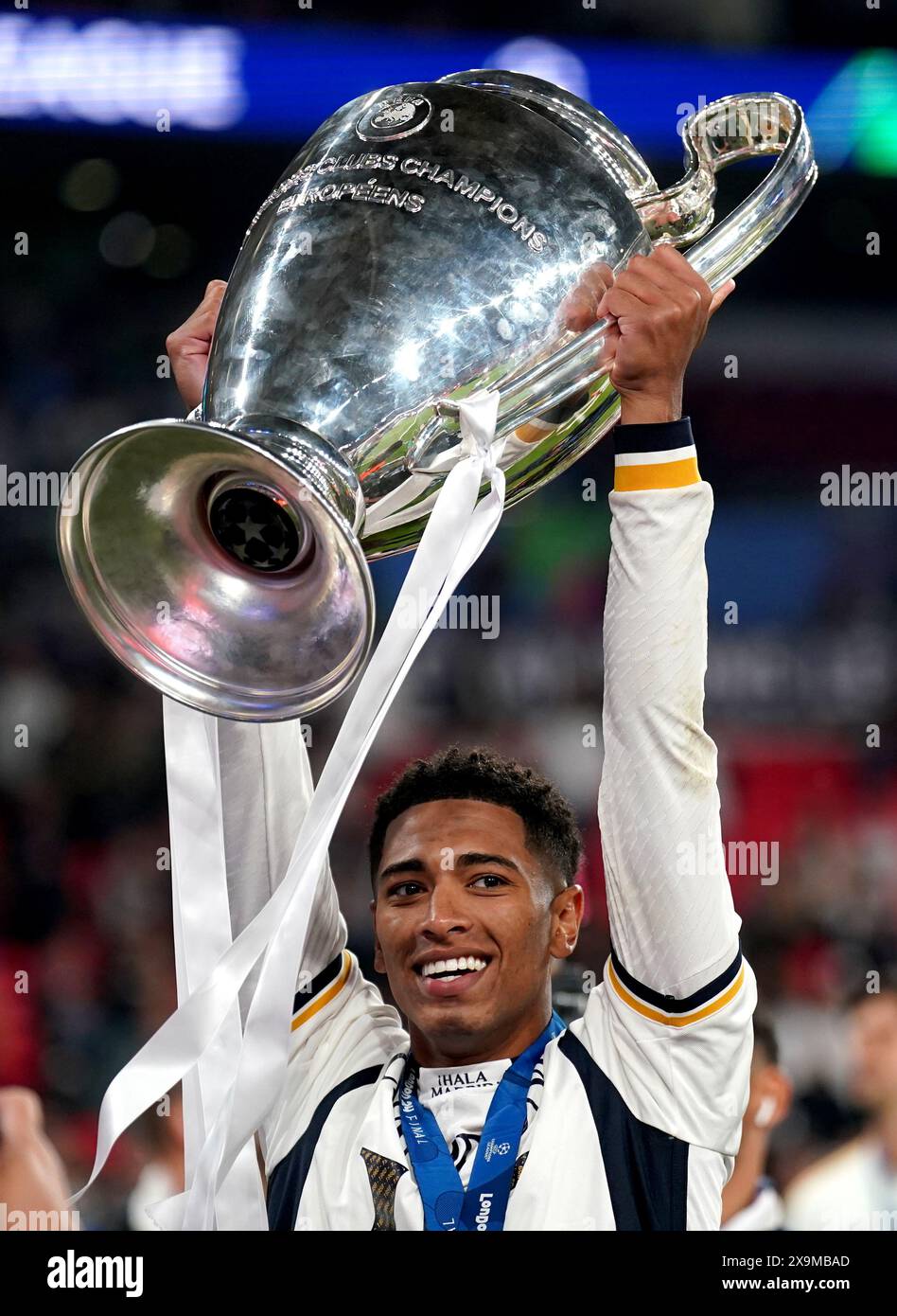 Real Madrid's Jude Bellingham celebrates with the trophy after winning ...
