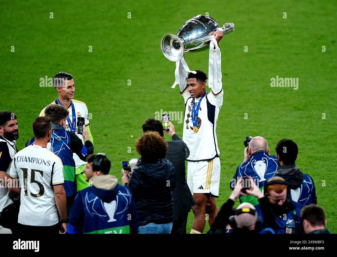 Real Madrid's Jude Bellingham celebrates with the trophy after winning ...