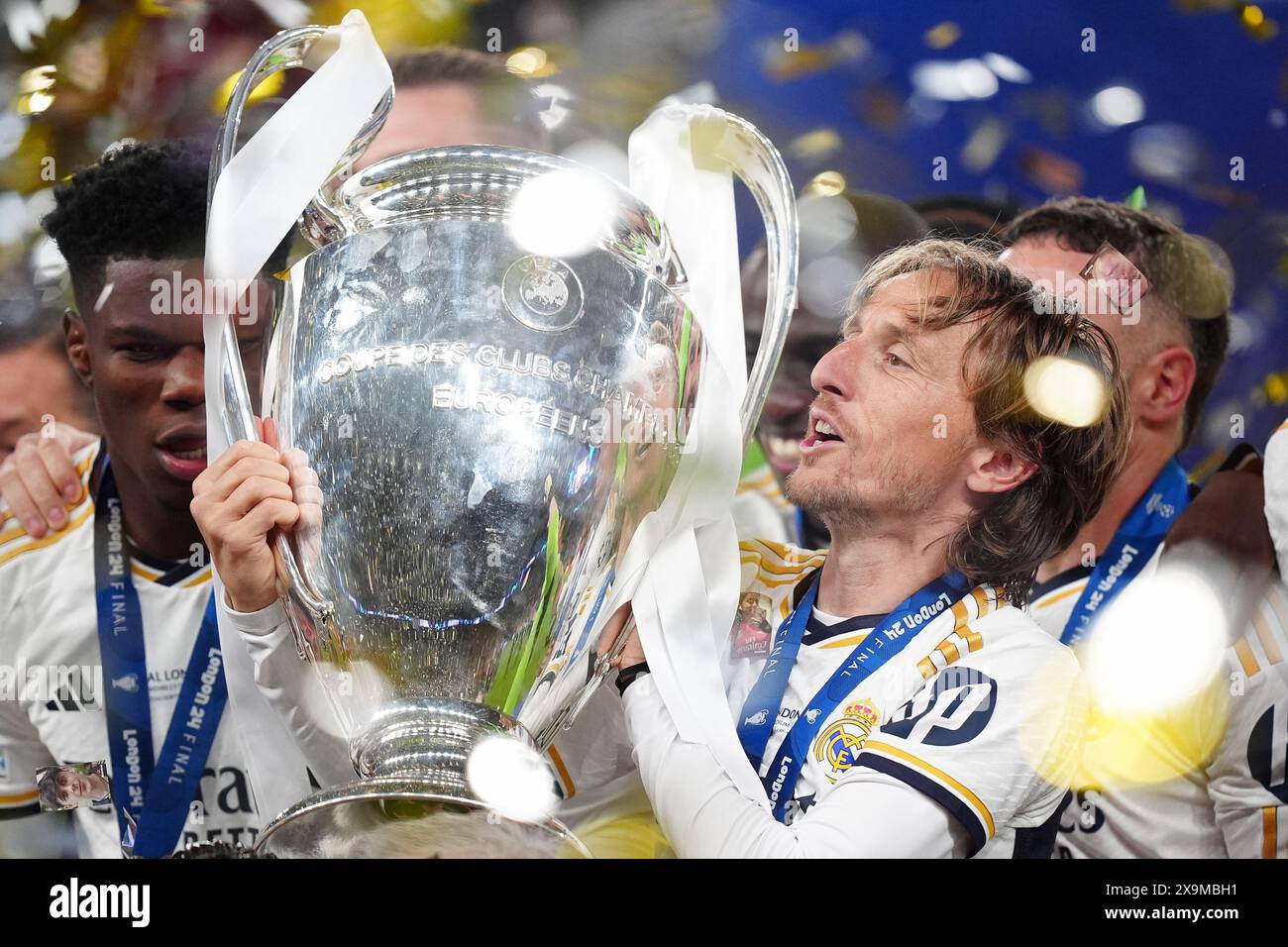 Real Madrid's Luka Modric celebrates with the trophy after winning the ...