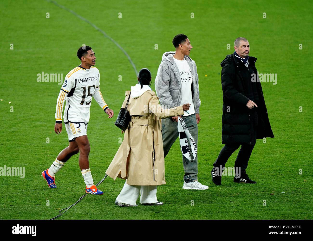 Real Madrid's Jude Bellingham (left) with his parents Mark Bellingham ...