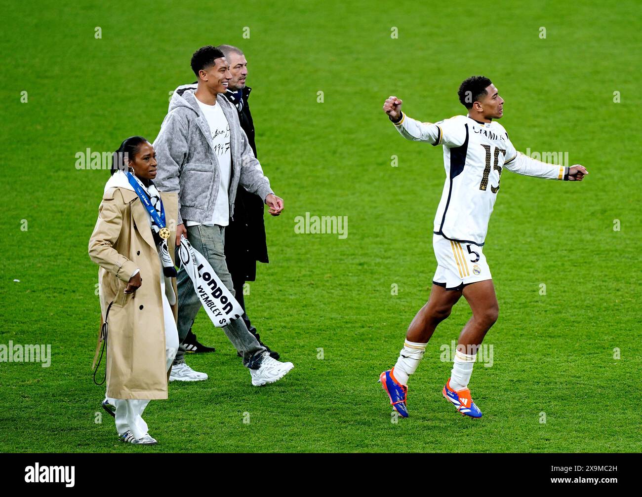 Real Madrid's Jude Bellingham (right) with his parents Mark Bellingham ...