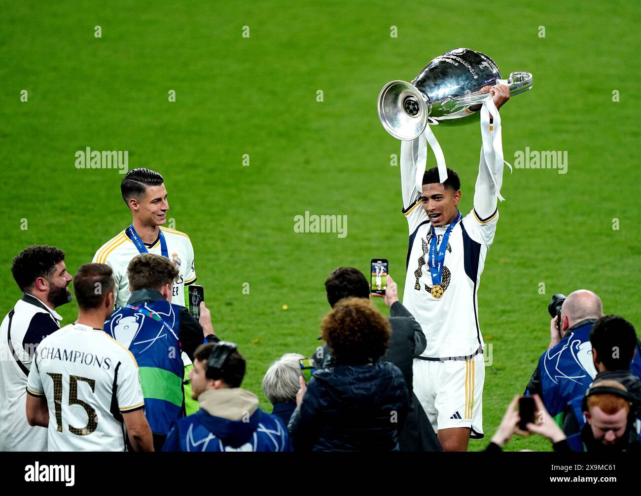 Real Madrid's Jude Bellingham celebrates with the trophy after winning ...