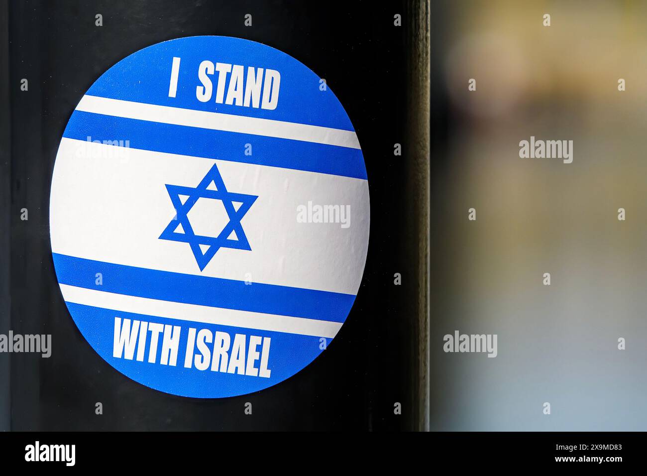 A round decal with the flag of Israel and the words "I STAND WITH ...