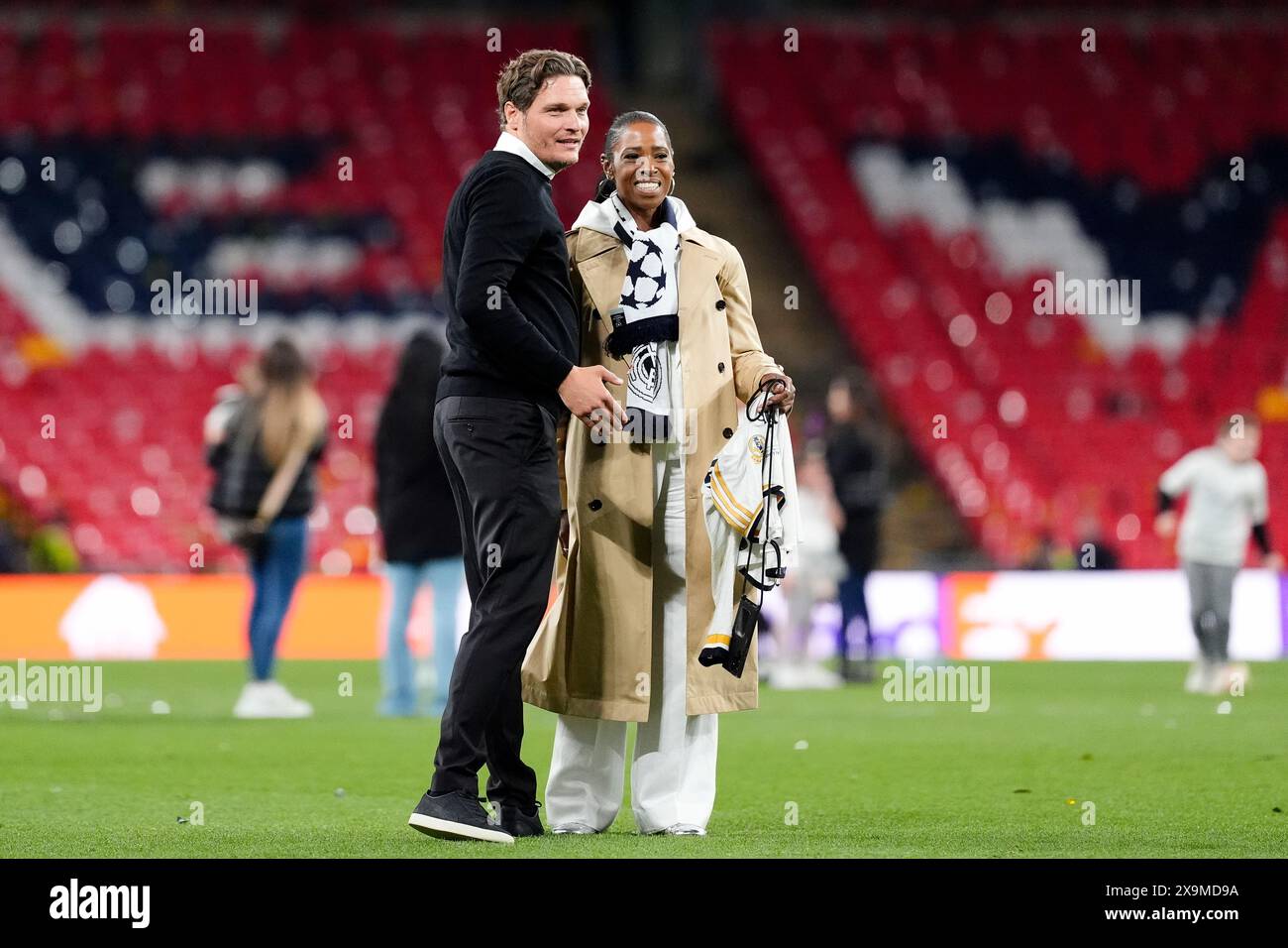 Borussia Dortmund head coach Edin Terzic (left) with Denise Bellingham ...