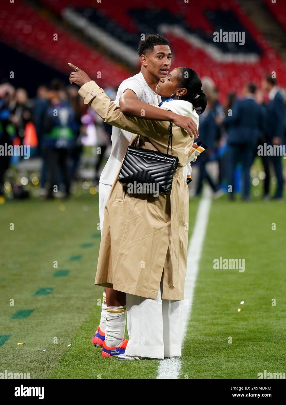 Real Madrid's Jude Bellingham hugs mum Denise Bellingham at the end of ...