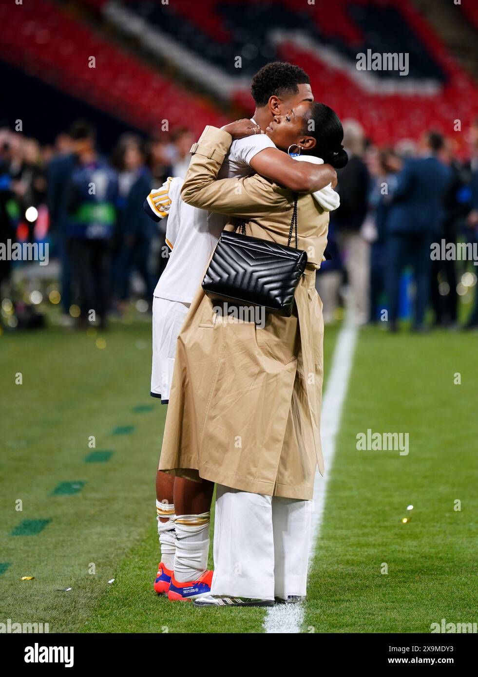 Real Madrid's Jude Bellingham hugs mum Denise Bellingham at the end of ...