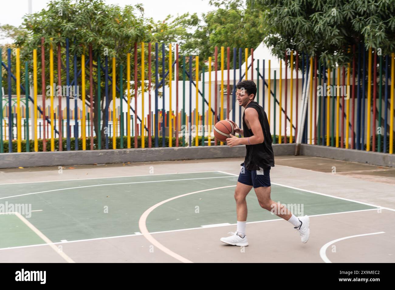 Young man dribbling colorful hi-res stock photography and images - Alamy