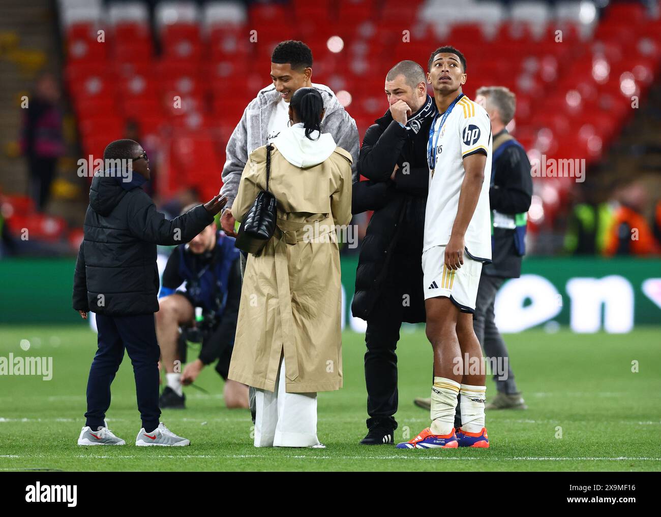 London, UK. 1st June, 2024. Jude Bellingham talks to his family after ...