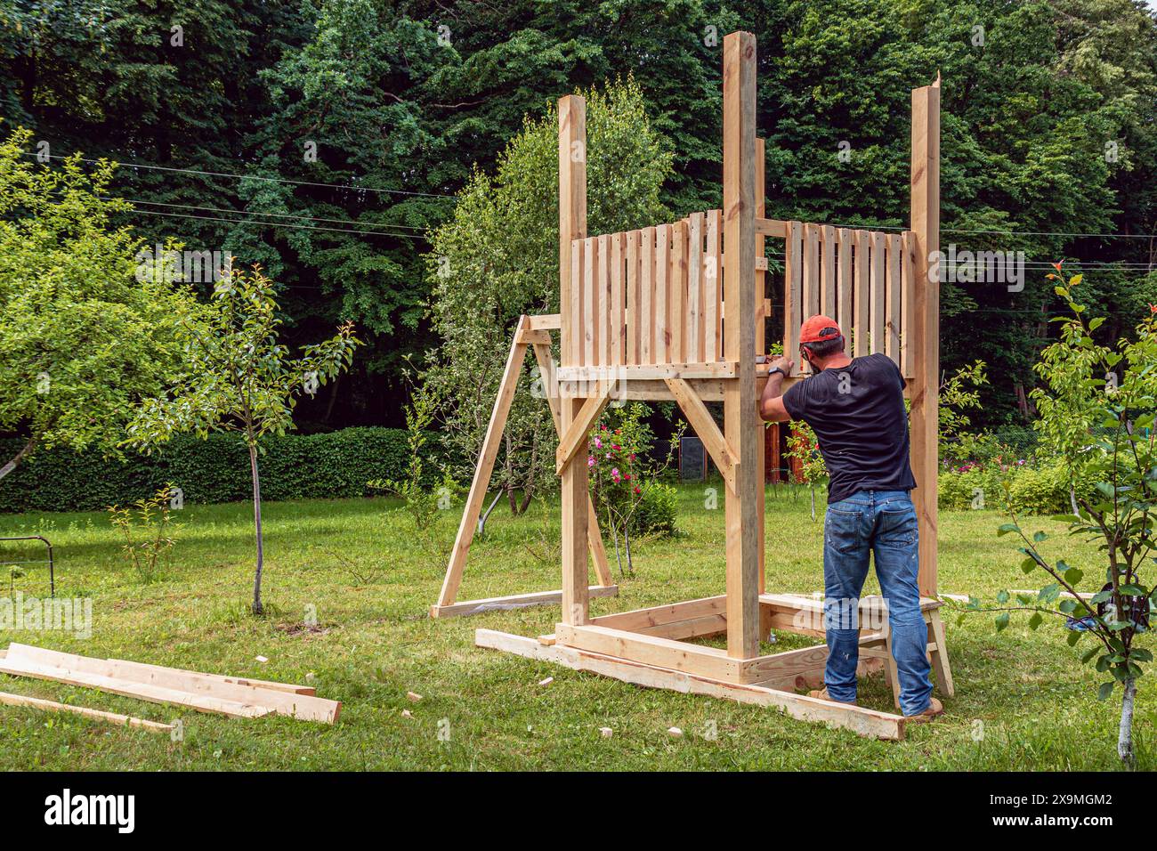 Construction of a children's house in the garden of a country house ...